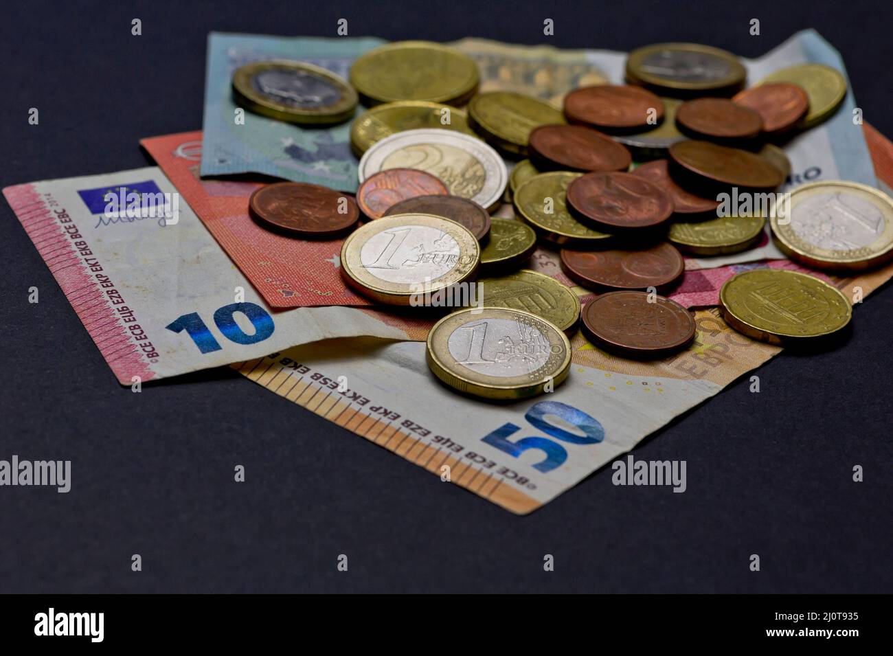 Euros on a table Stock Photo - Alamy
