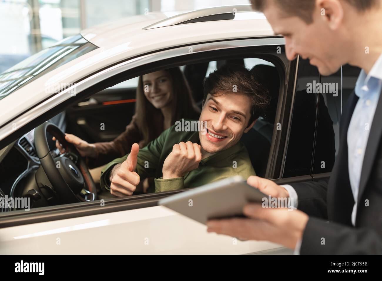 Female customer visiting auto salon hi-res stock photography and images ...