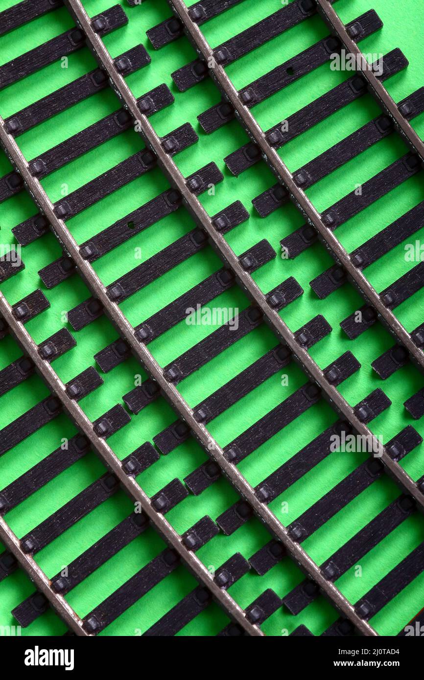 Curved oo gauge model railway track isolated on a green background ...