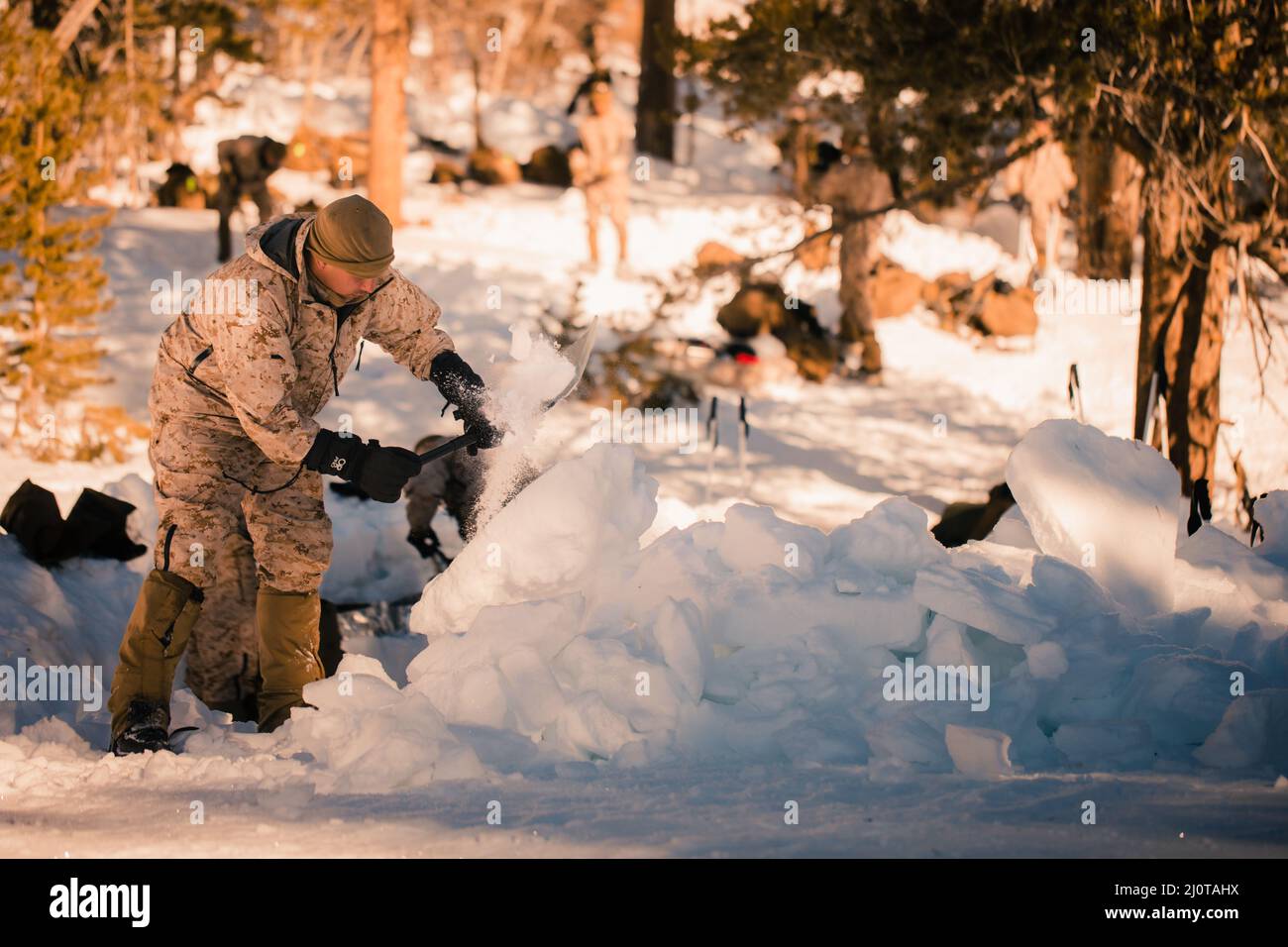 A U.S. Marine with 3d Battalion, 3d Marines, 3d Marine Division shovels ...