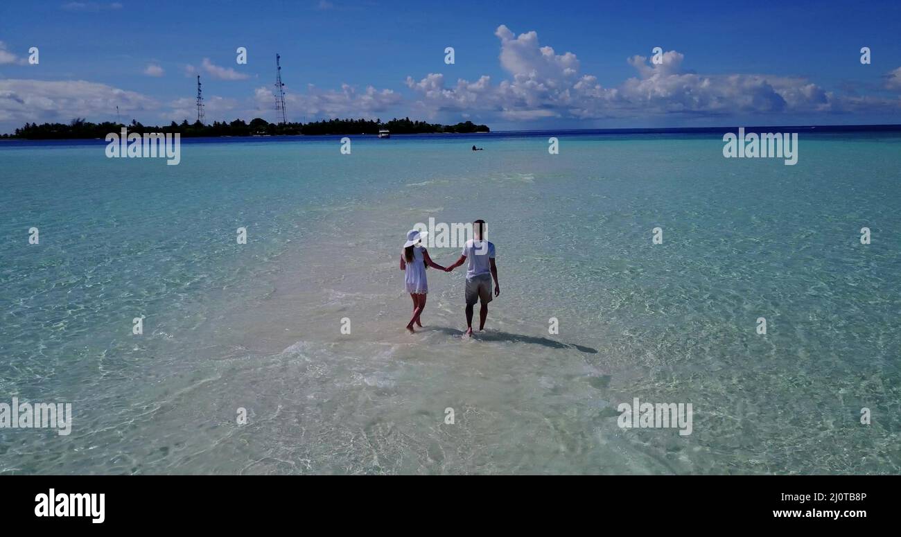 Couple on the beach in Rasdhoo Atoll, Rasdhoo Island, The Maldives ...