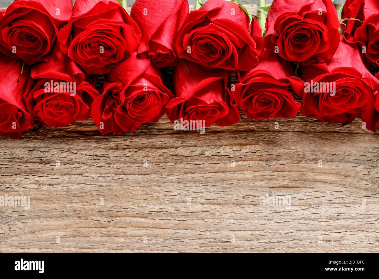 Red roses on wood. Graphic resources Stock Photo - Alamy