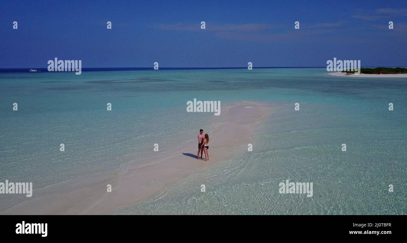 Couple on the beach in Rasdhoo Atoll, Rasdhoo Island, The Maldives ...