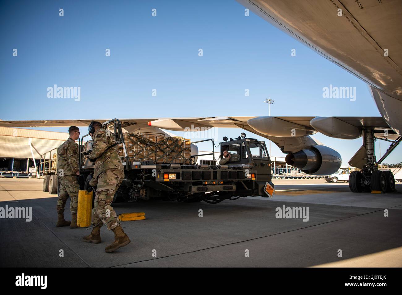 U.S. Airmen from the 60th Aerial Port Squadron load cargo on to a 757 ...