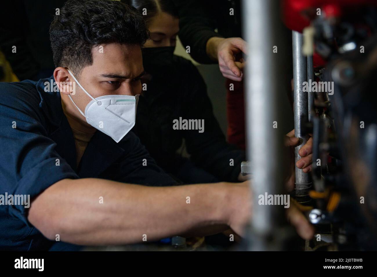 ATLANTIC OCEAN – Damage Controlman Fireman Emmanuel Neri drains oil ...