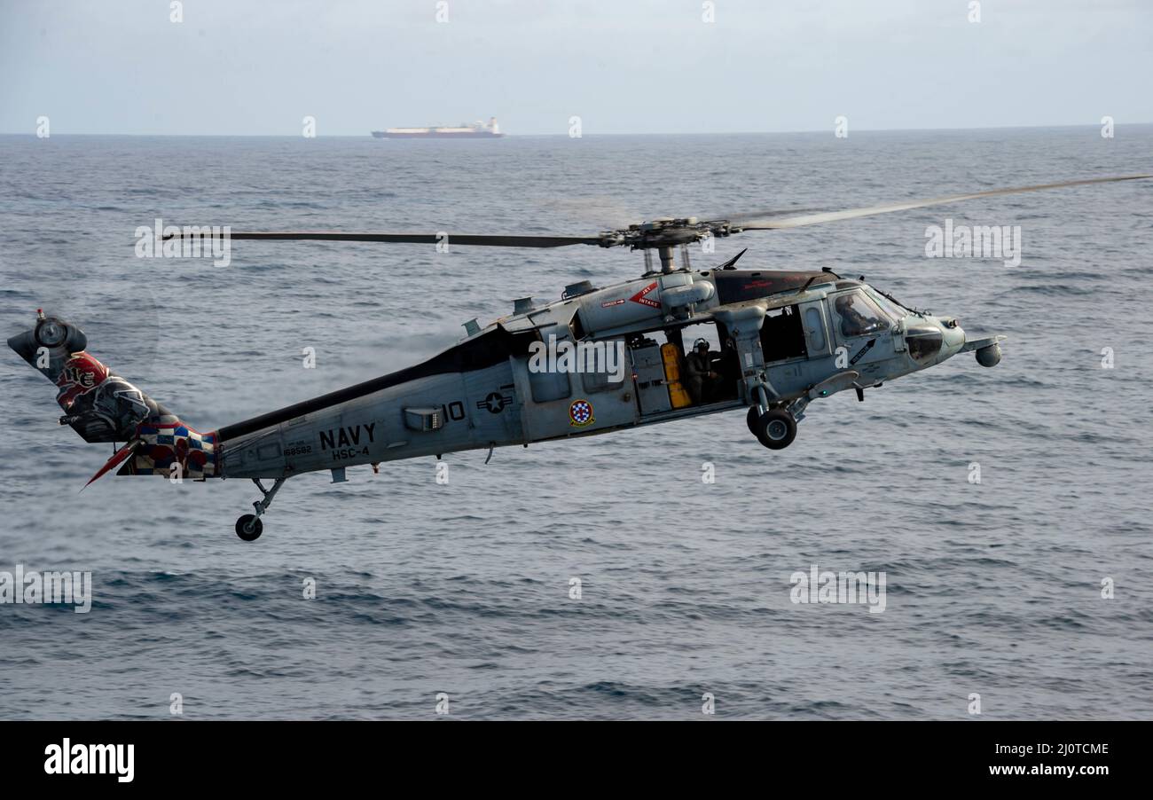 220123-N-MD461-1018 SOUTH CHINA SEA (Jan. 23, 2022) An MH-60S Sea Hawk ...