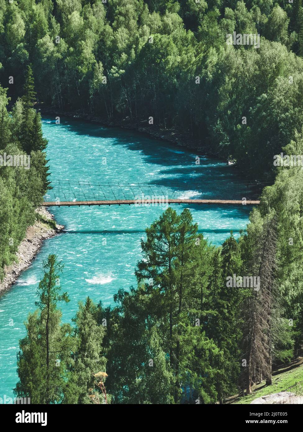 Beautiful aerial view of a crystal blue River in a dense forest Stock Photo - Alamy