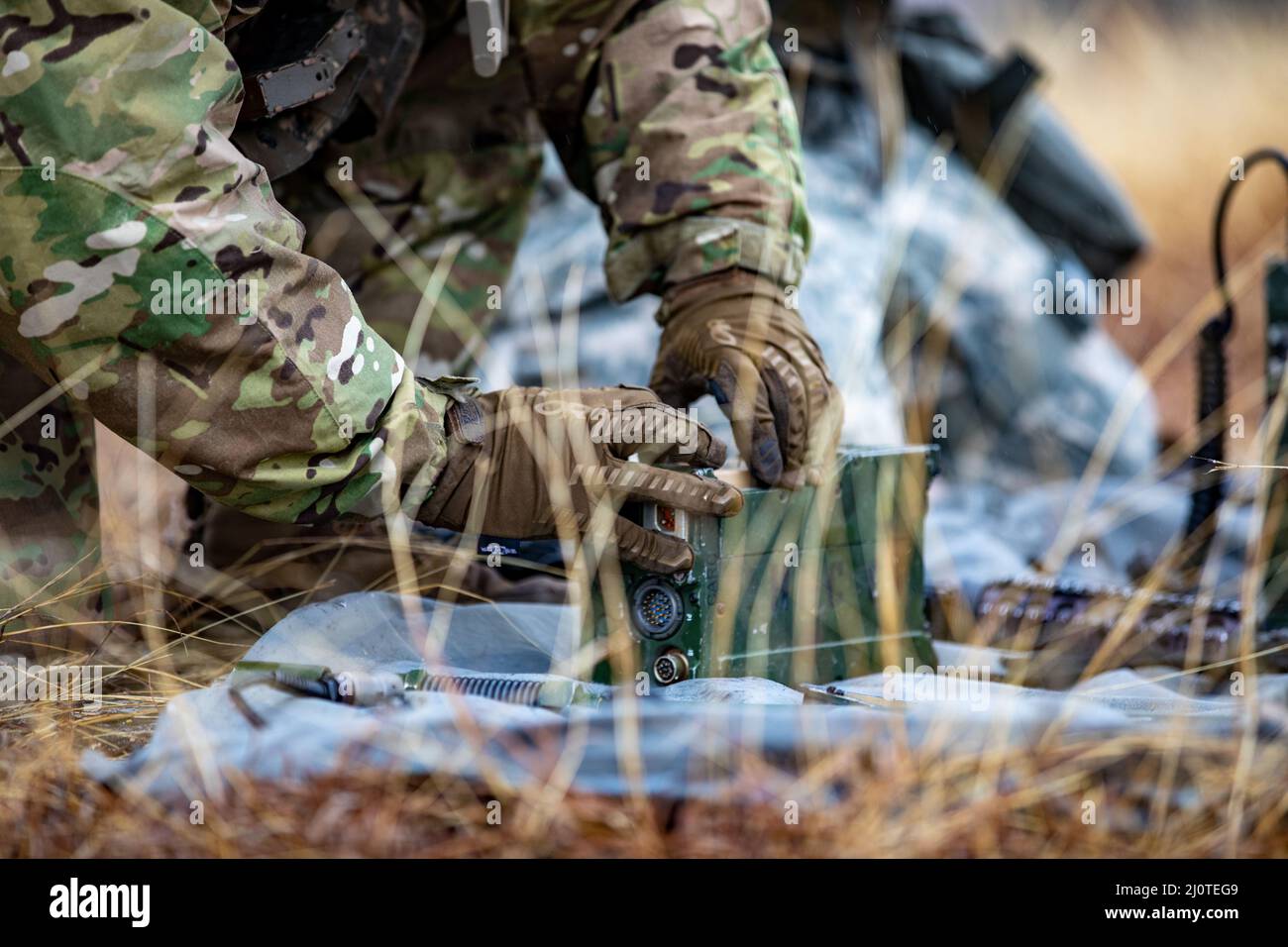 A Soldier assembles a SINCGARS RT-1523 VHF Radio during the Army's Best ...