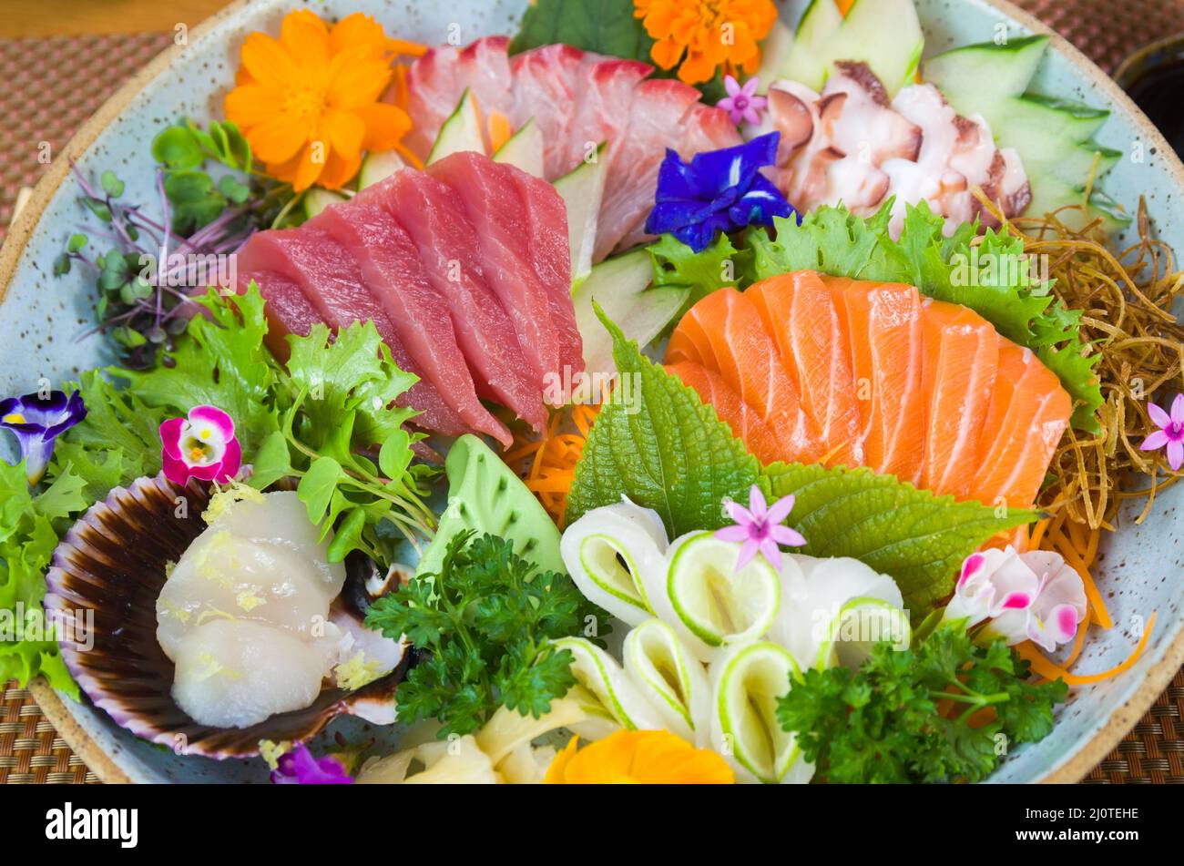 Platter decorated with different flavors of elegant sashimi sushi ...