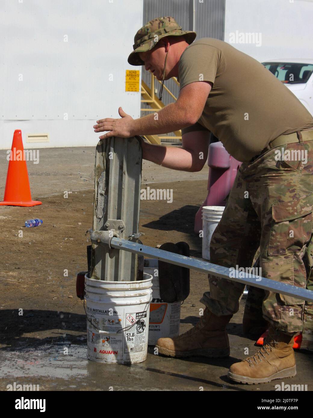 Tech. Sgt. Jonathan Russell cleans off tools after working with freshly ...