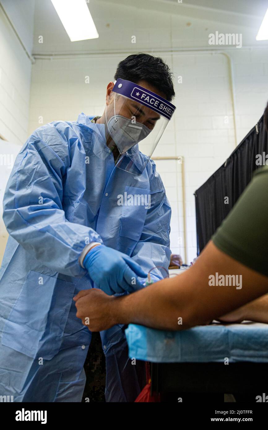 U.S. Navy Chief Petty Officer Jan Marayag, a laboratory chief with the ...
