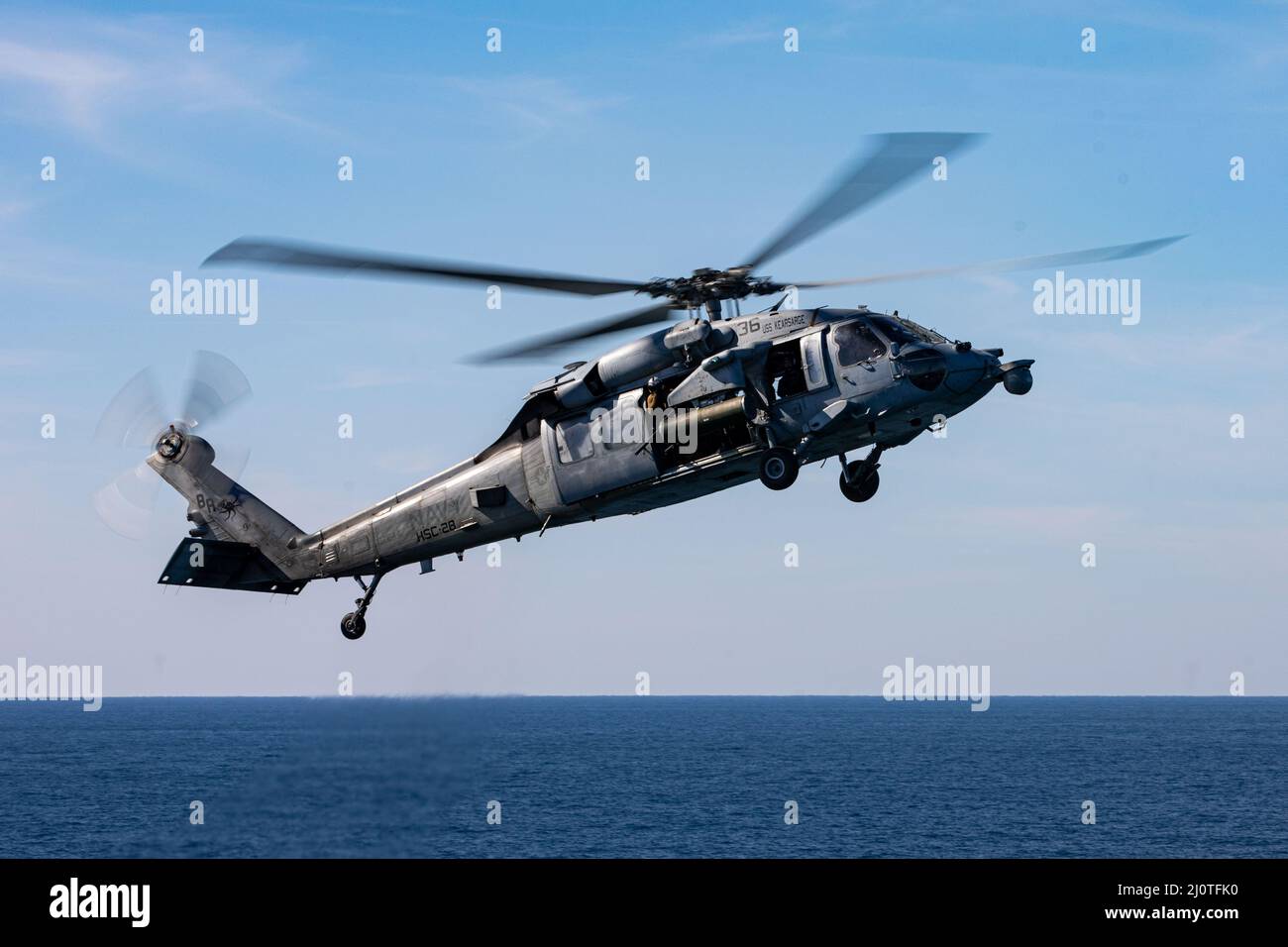A U.S. Navy MH-60 Seahawk conducts flight operations during Composite ...