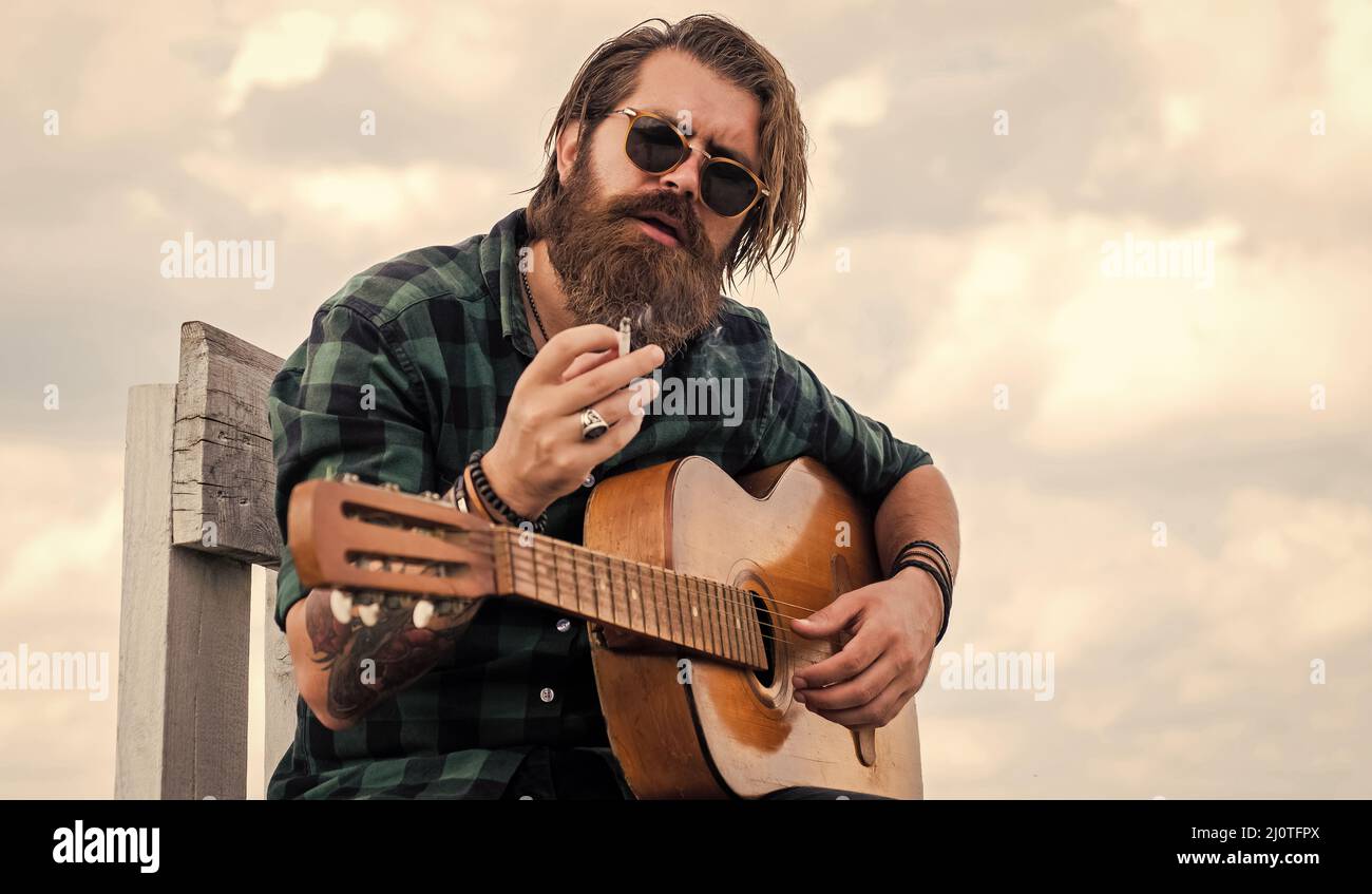 male guitarist with musical instrument. country music concept. bearded ...