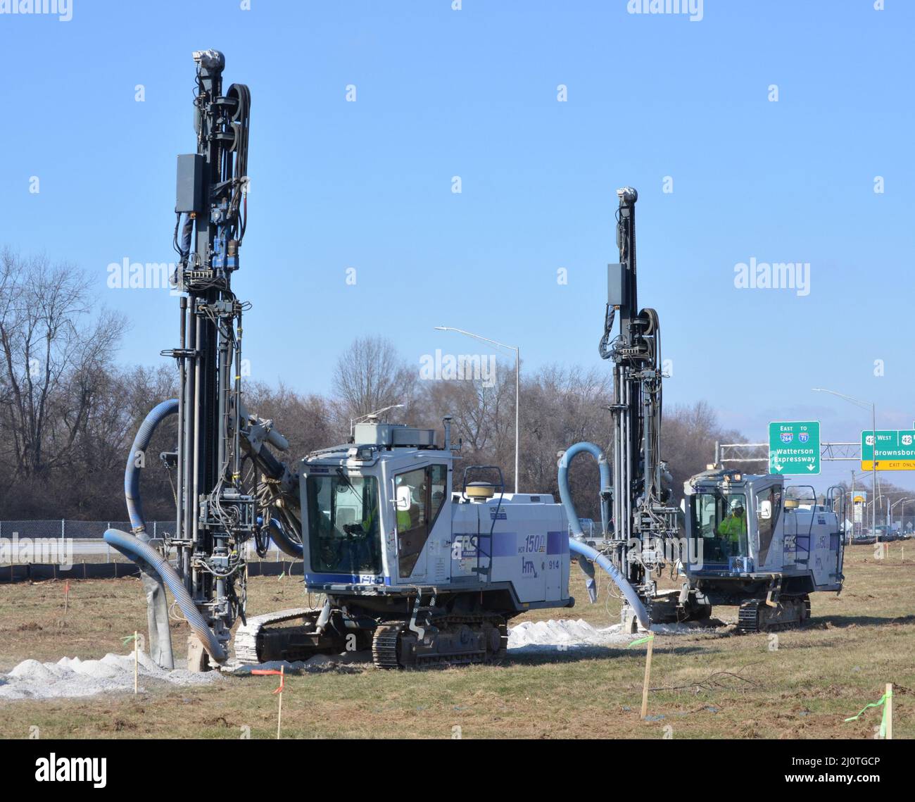 Contractors perform various earth work activities while preparing the ...