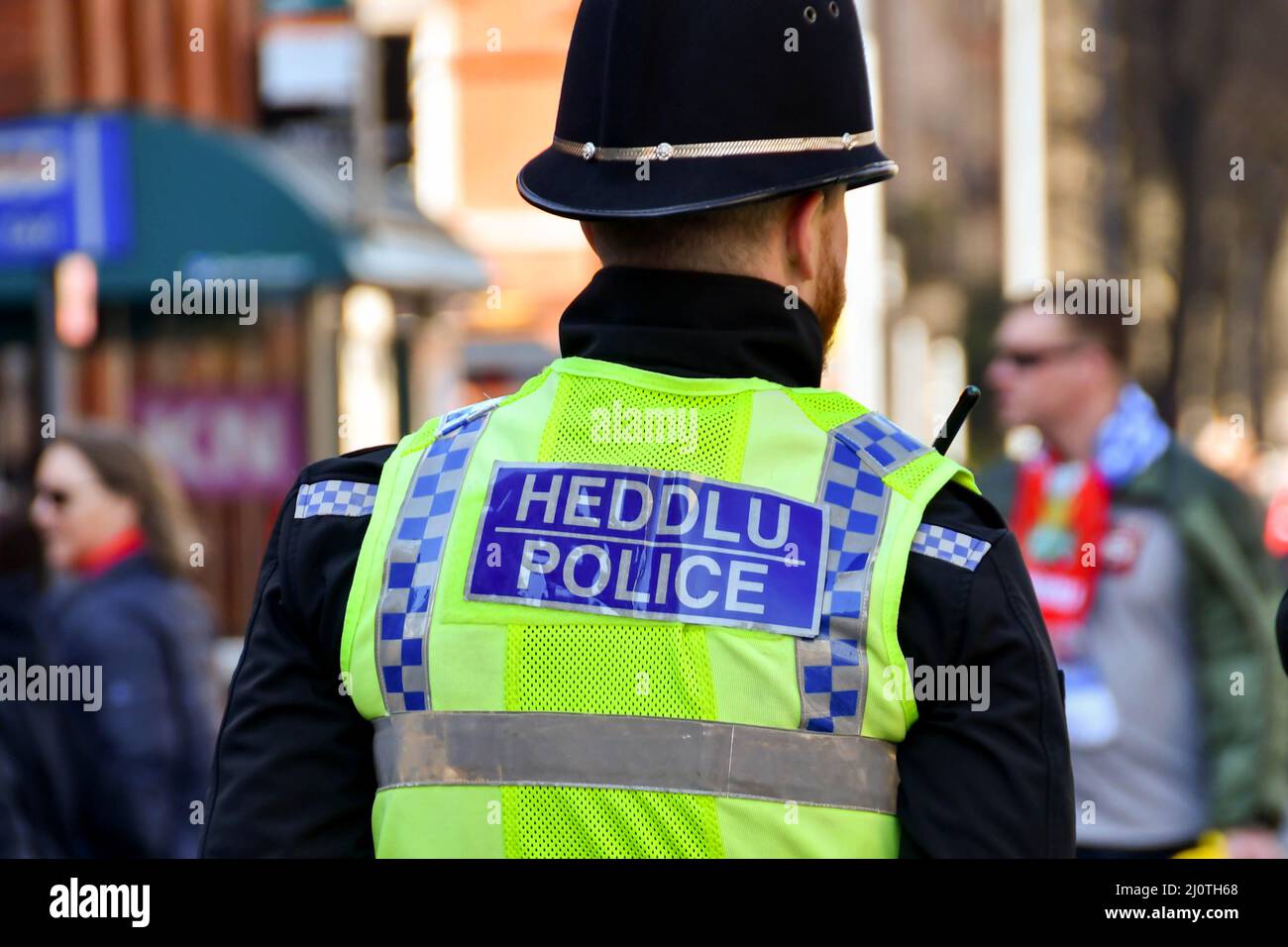 Cardiff, Wales - March 2022: Rear view of a police officer on duty in ...