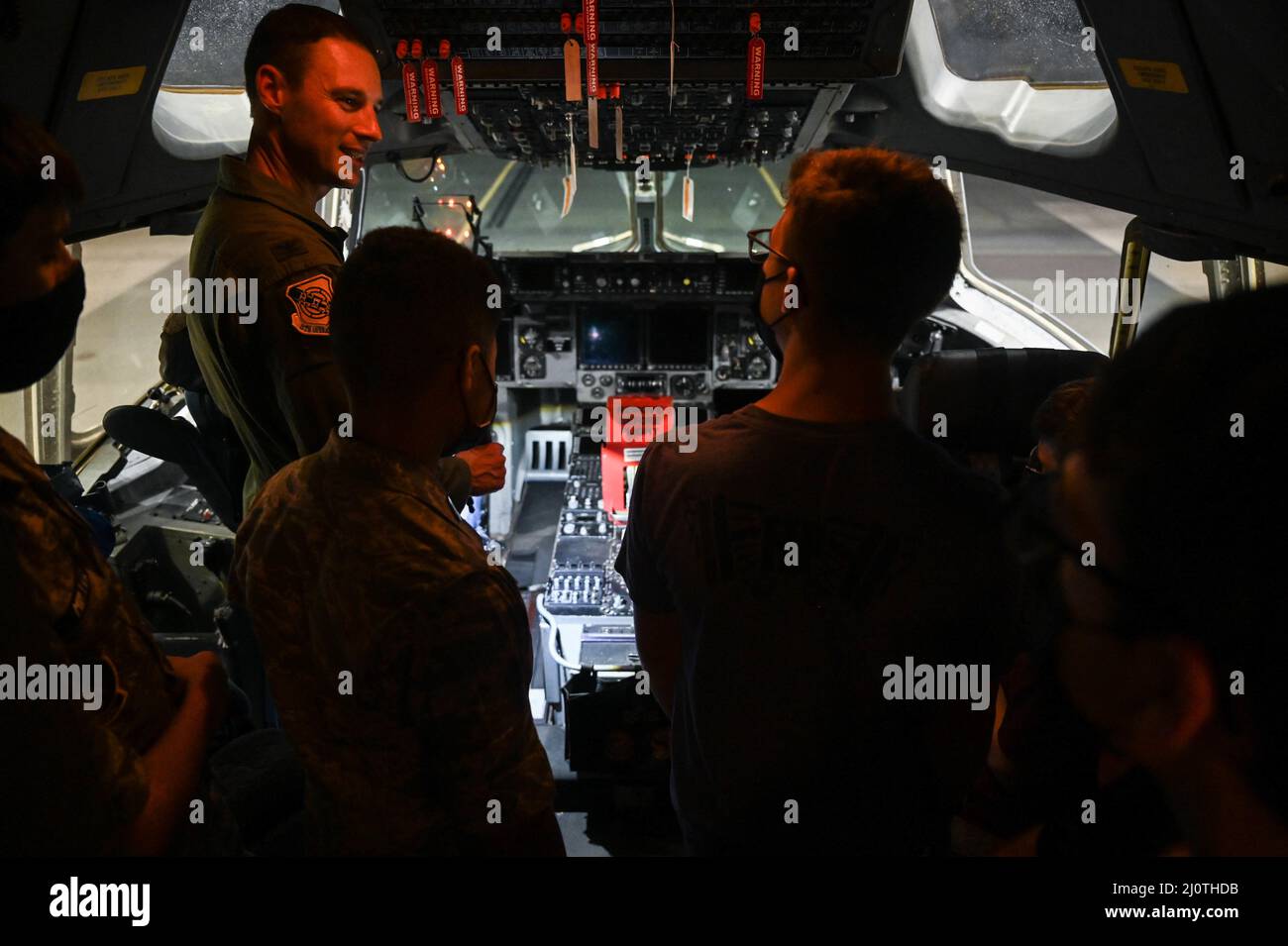 Col. Garrett Fisher, 15th Operations Group commander, demonstrates ...