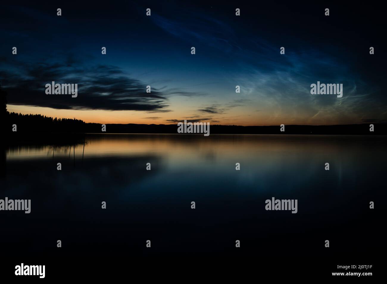 View of a body of water with a colorful evening sky in the background ...