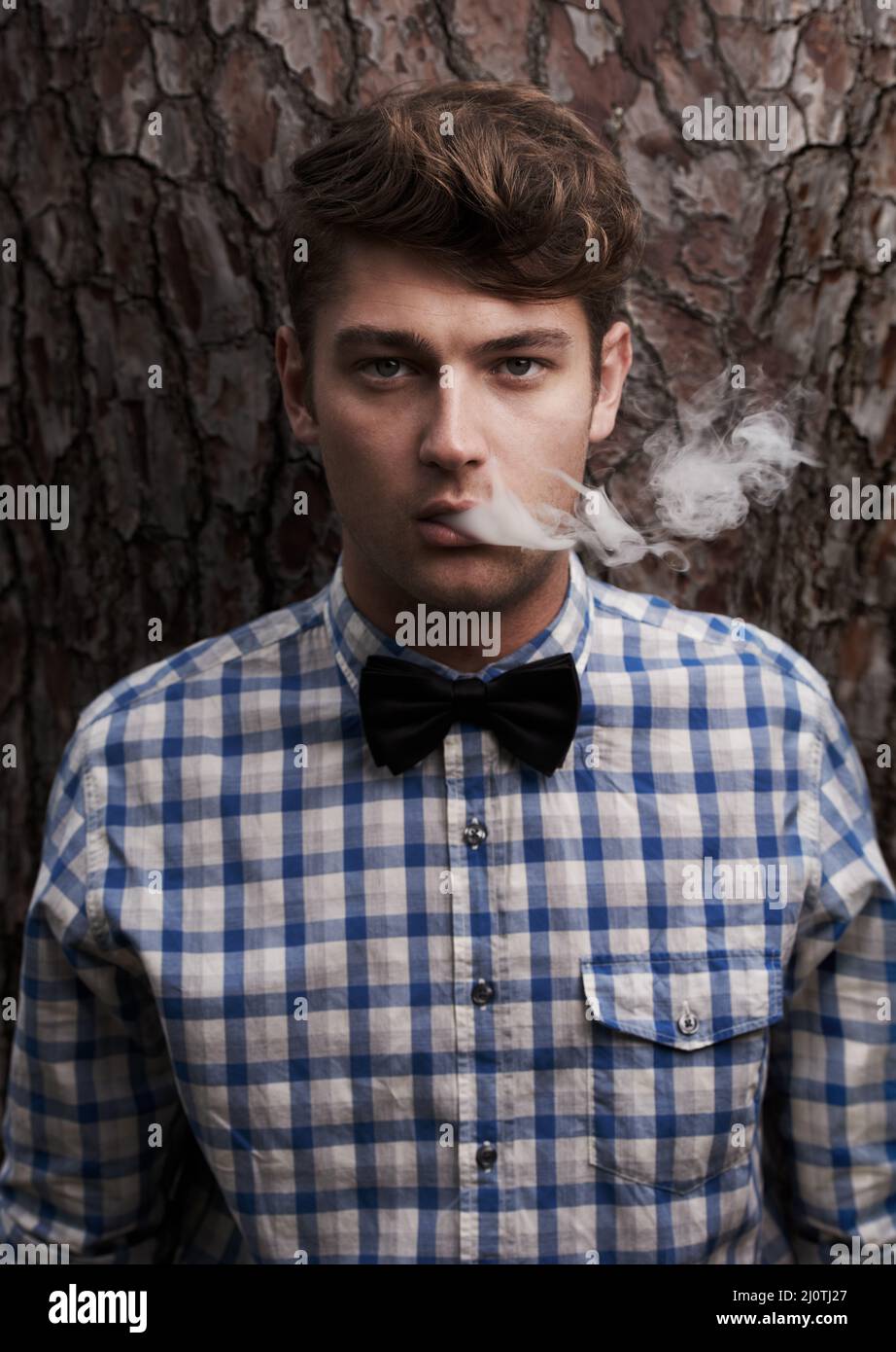 Man smoking cigarette in the forest hi-res stock photography and images ...