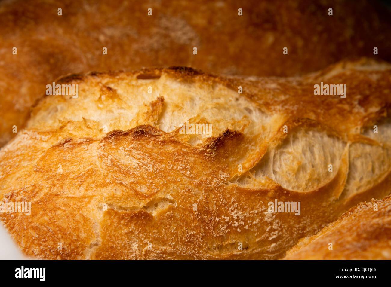 Close-up Fresh loaves of artisan hot bread. Delicious and healthy food ...