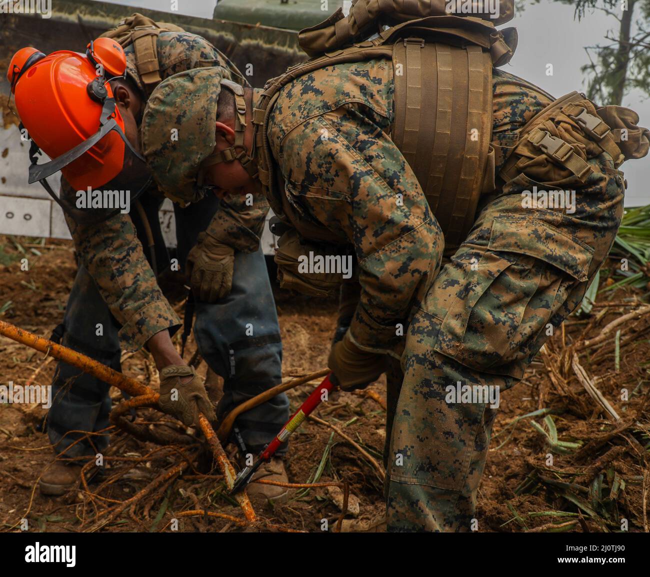 U.S. Marine Corps Lance Cpl. Hugh Nash, (left), and Cpl. Samuel Llamas ...