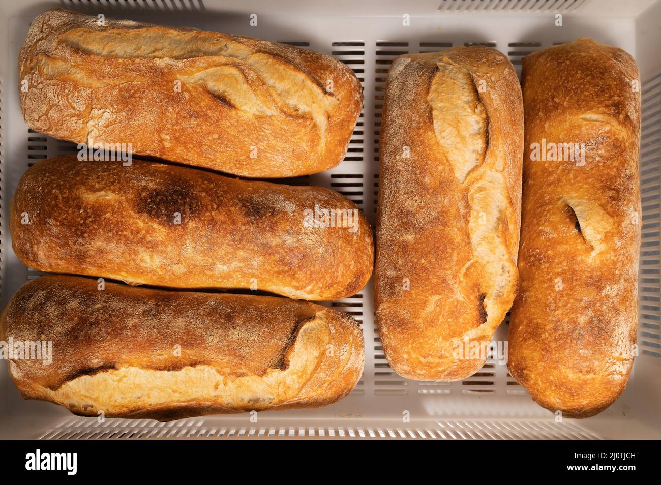 Top view Fresh loaves of artisan hot bread. Delicious and healthy food ...