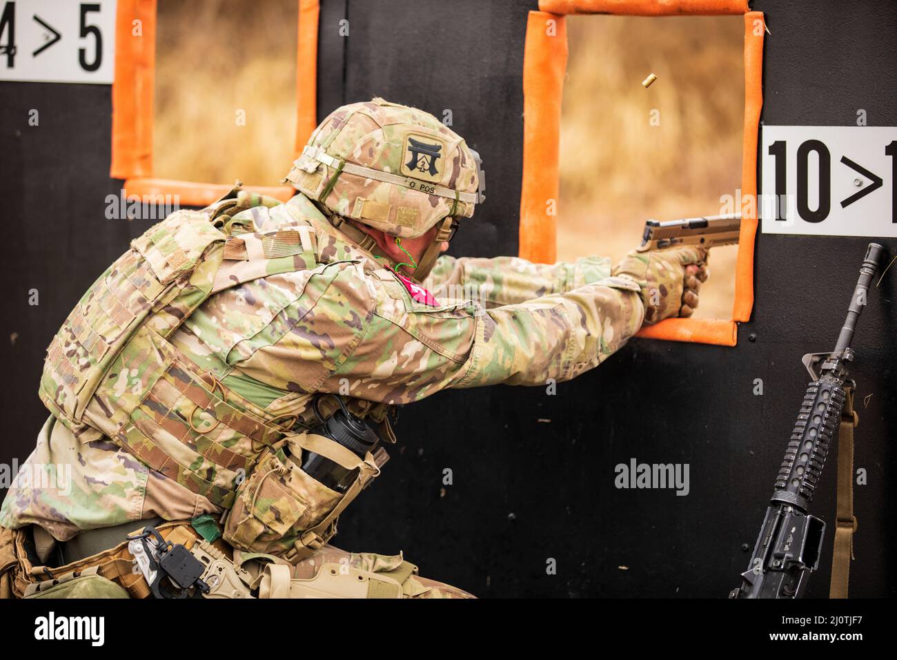 Sgt. William Brandon, 101st Airborne Division, conducts small arms fire ...