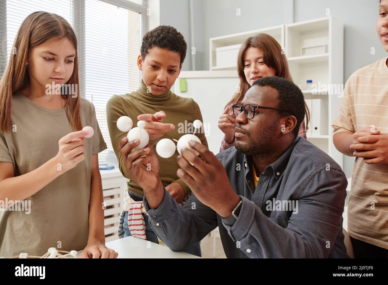 Boy girl boys girls teacher man hi-res stock photography and images - Alamy