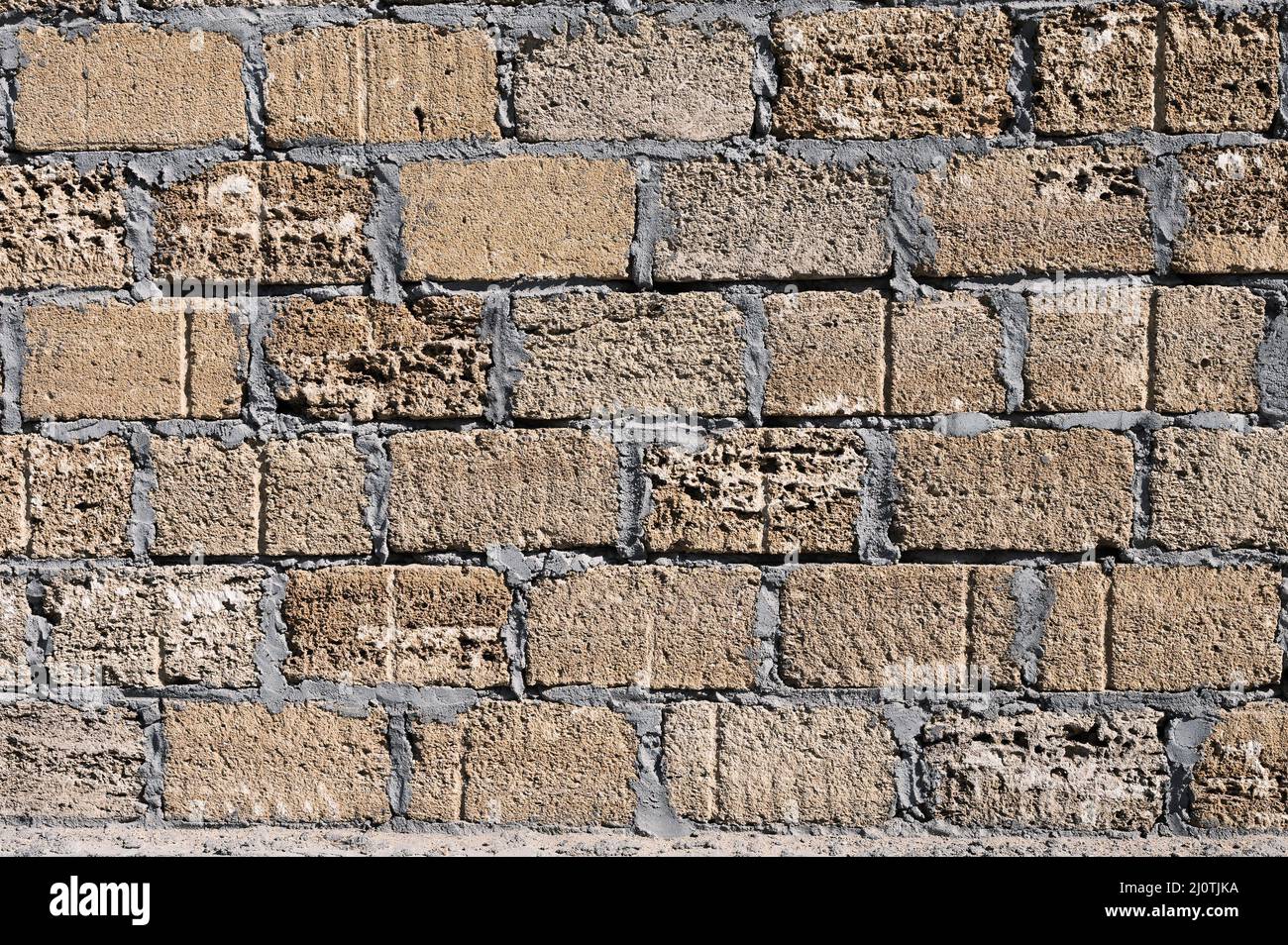 Background. Stone wall texture. The shell rock material is bonded with ...