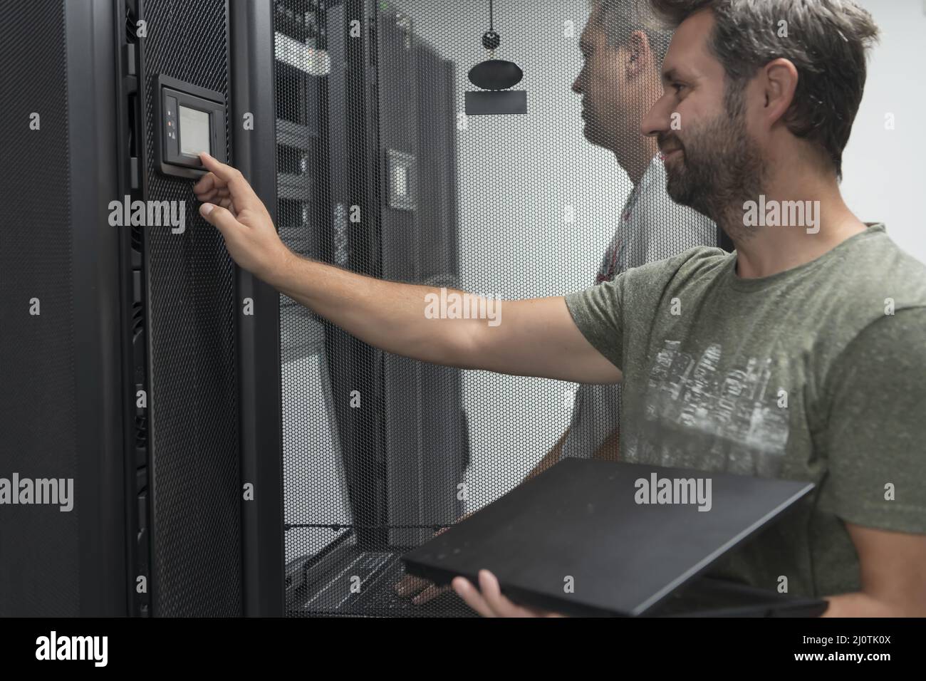 Technicians team updating hardware inspecting system performance in ...