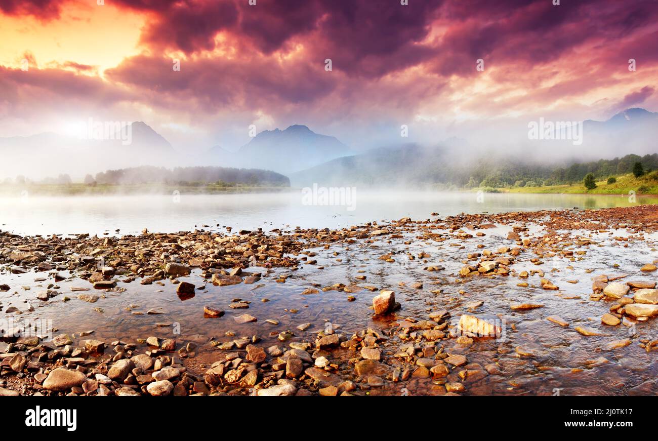Beautiful view of sinuous river in summer. Dramatic overcast sky ...