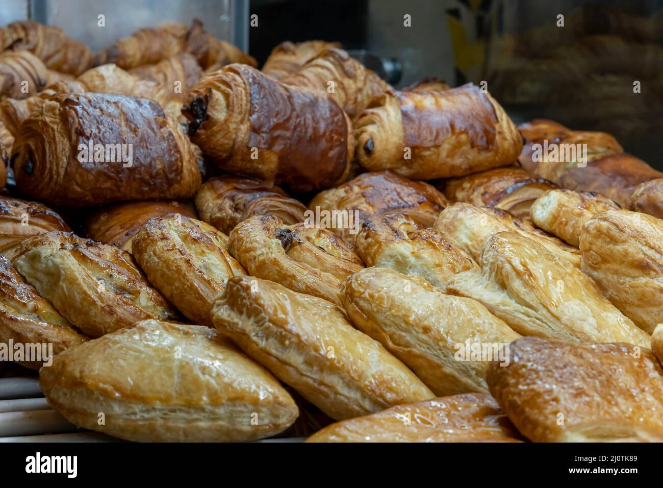 Artisan baker and pastry chef. Detail of mixed pastries in a bakery ...