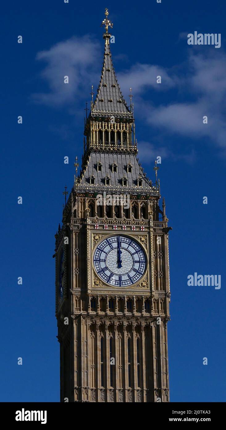 17 March 2022 - London: Vertical image of Big Ben against deep blue sky ...