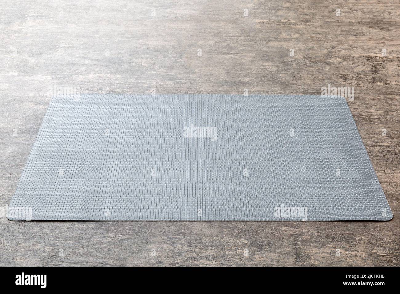 Perspective view of grey tablecloth for food on cement background ...