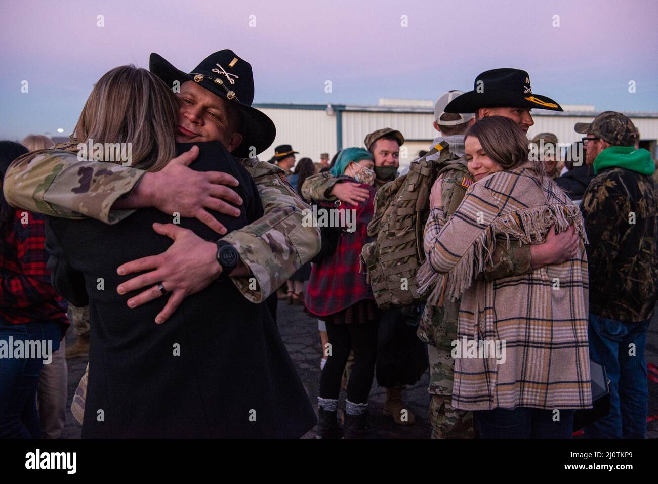 Family members embrace and greet Oregon Army National Guard Soldiers ...