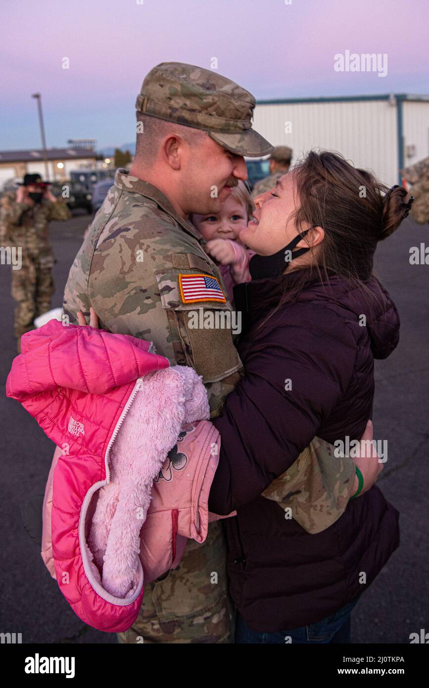 Family members embrace and greet Oregon Army National Guard Soldiers ...