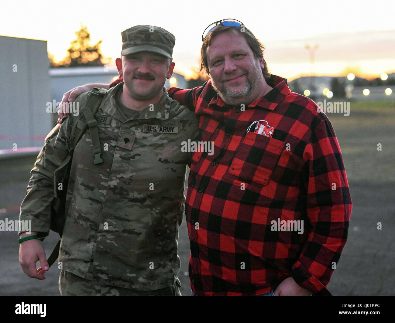 Family members embrace and greet Oregon Army National Guard Soldiers ...