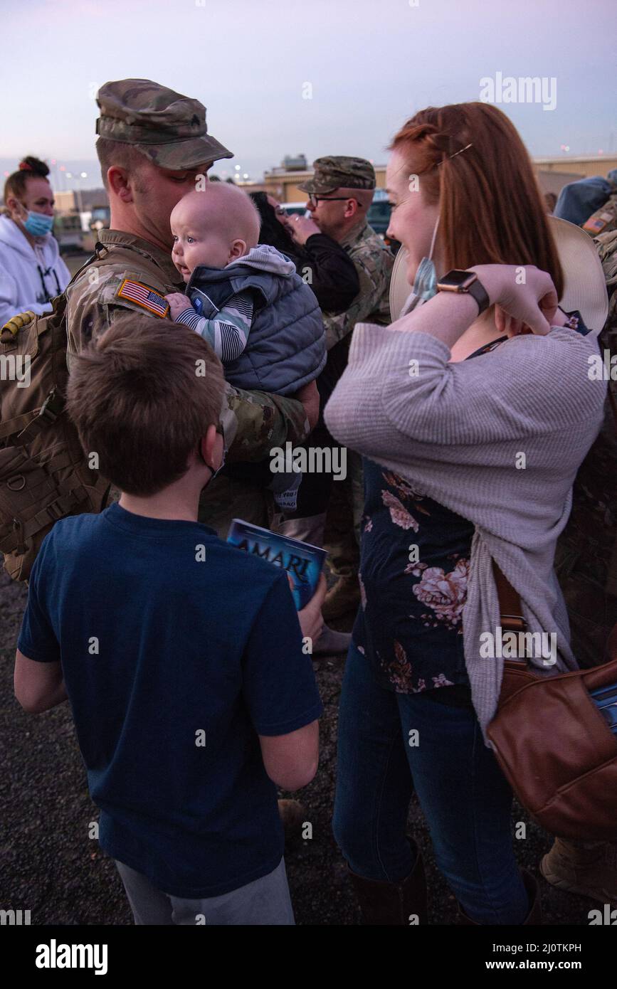 Family members embrace and greet Oregon Army National Guard Soldiers ...