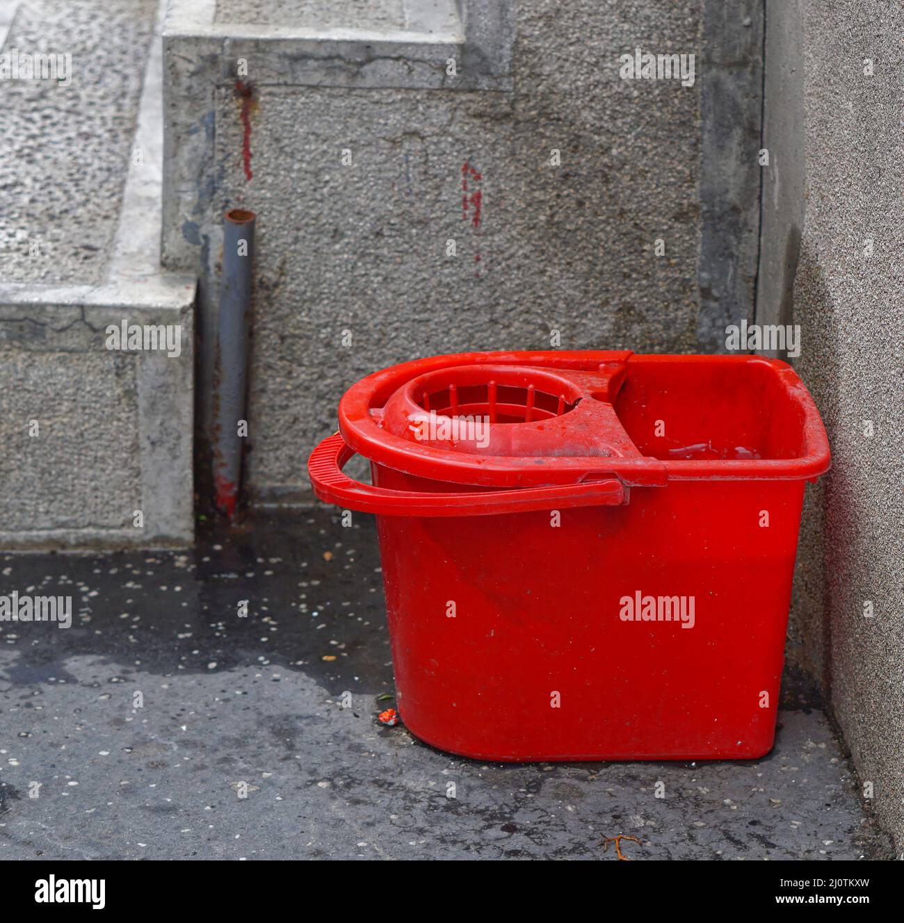 Red sturdy plastic water bucket pail for cleaning floors Stock Photo ...