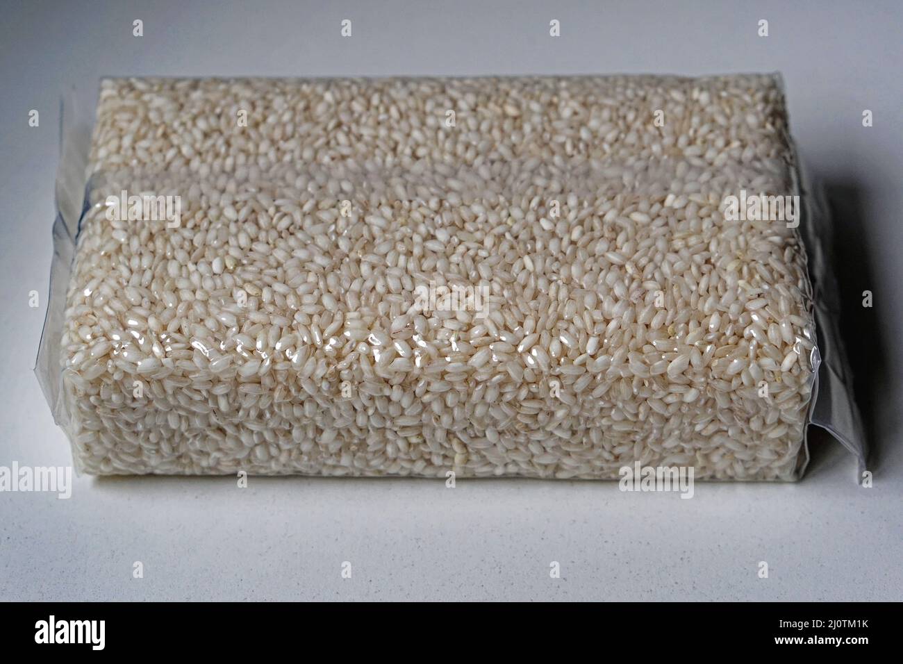 Vacuum sealed bag of white risotto rice Stock Photo - Alamy