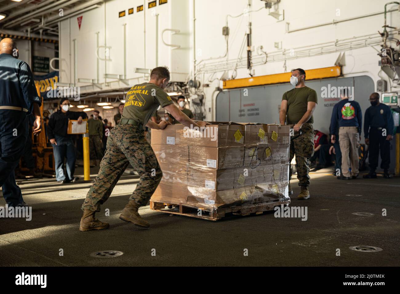 U.S. Marines assigned to the 22nd Marine Expeditionary Unit move ...