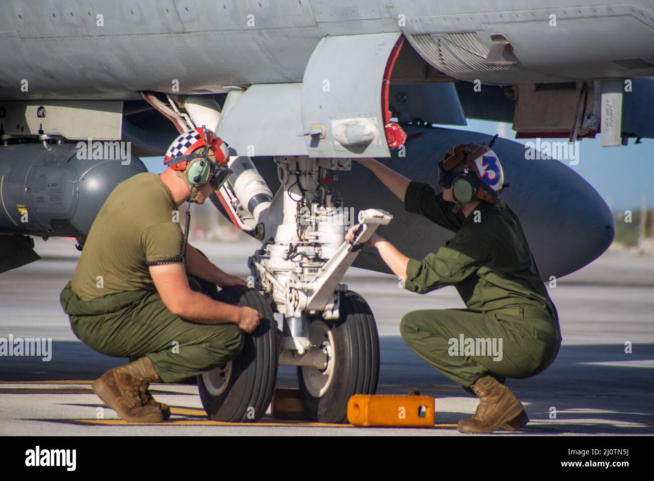 U.S. Marine Corps Cpl. Cameron Sousa (left), an aircraft ordnance ...