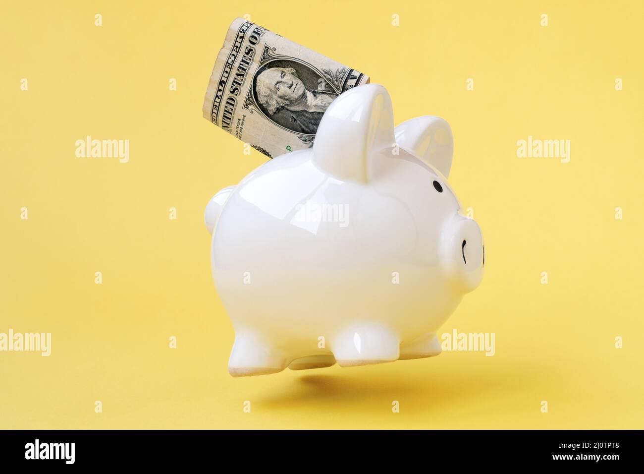 American currency in a piggy bank Stock Photo - Alamy