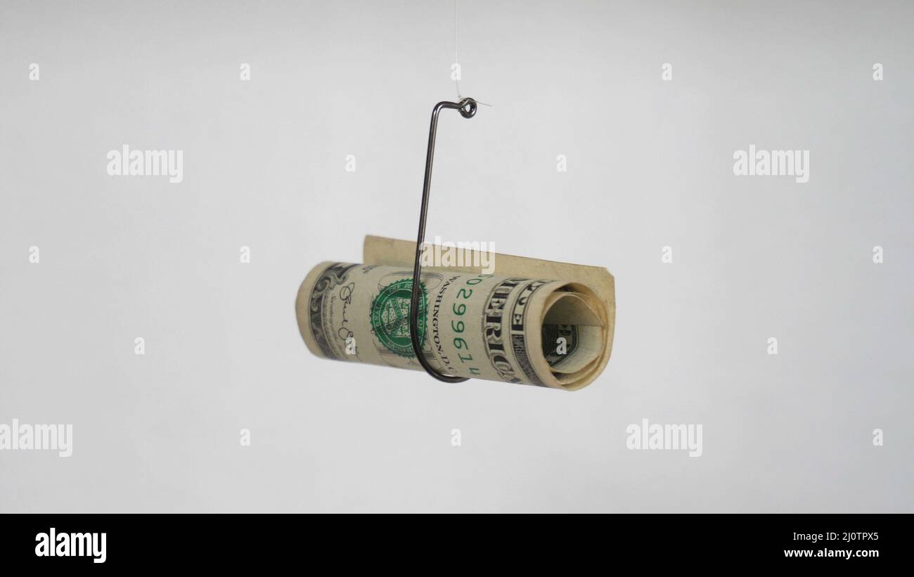 Dollar On A Fishing Hook Isolated On White Background Stock Photo - Alamy