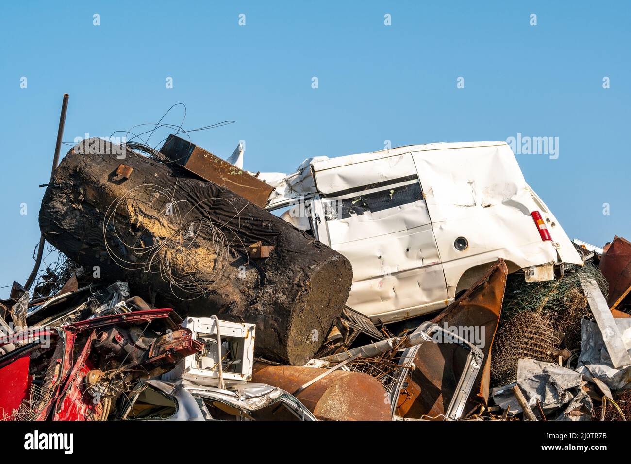 Scrapheap at a scrap metal business site, blue sky Stock Photo - Alamy