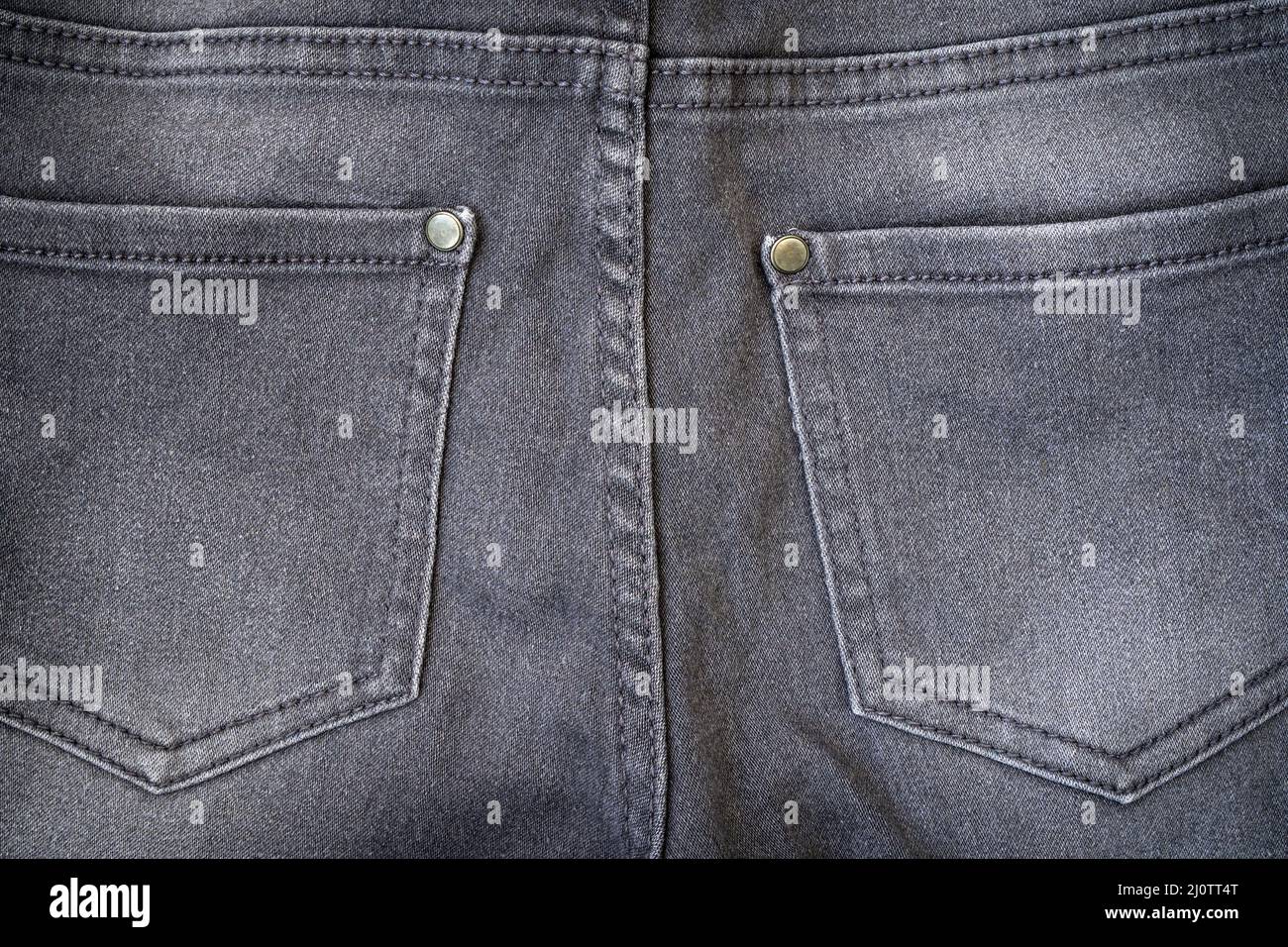 Dark grey jeans denim texture- back view pockets Stock Photo - Alamy