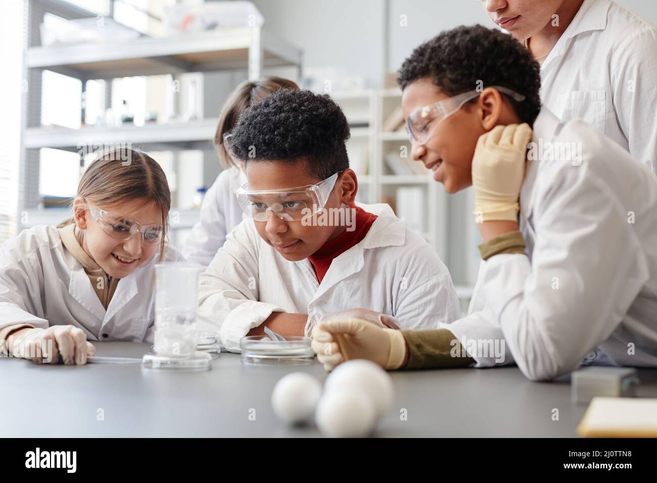 Portrait of African American boy enjoying enjoying science experiments ...