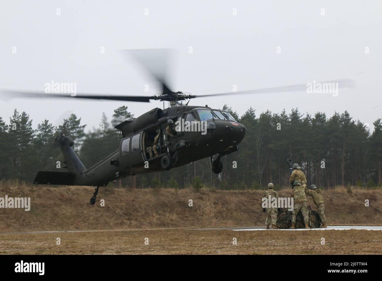 Air assault instructors and students conduct sling-load operations with ...
