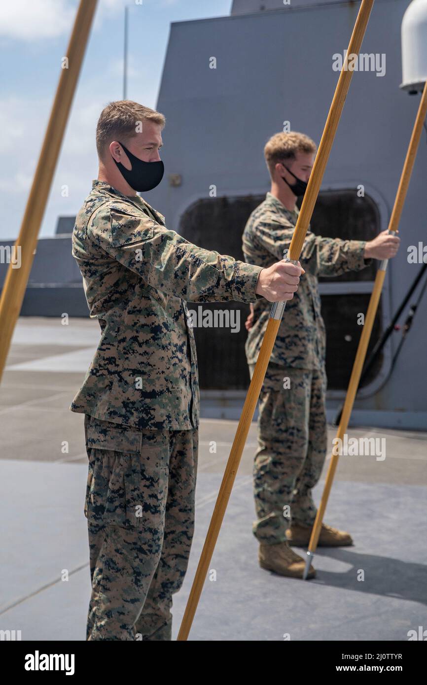 SULU SEA (Jan. 28, 2022) U.S. Marine Corps Cpl. Gavin Newton, left, a ...