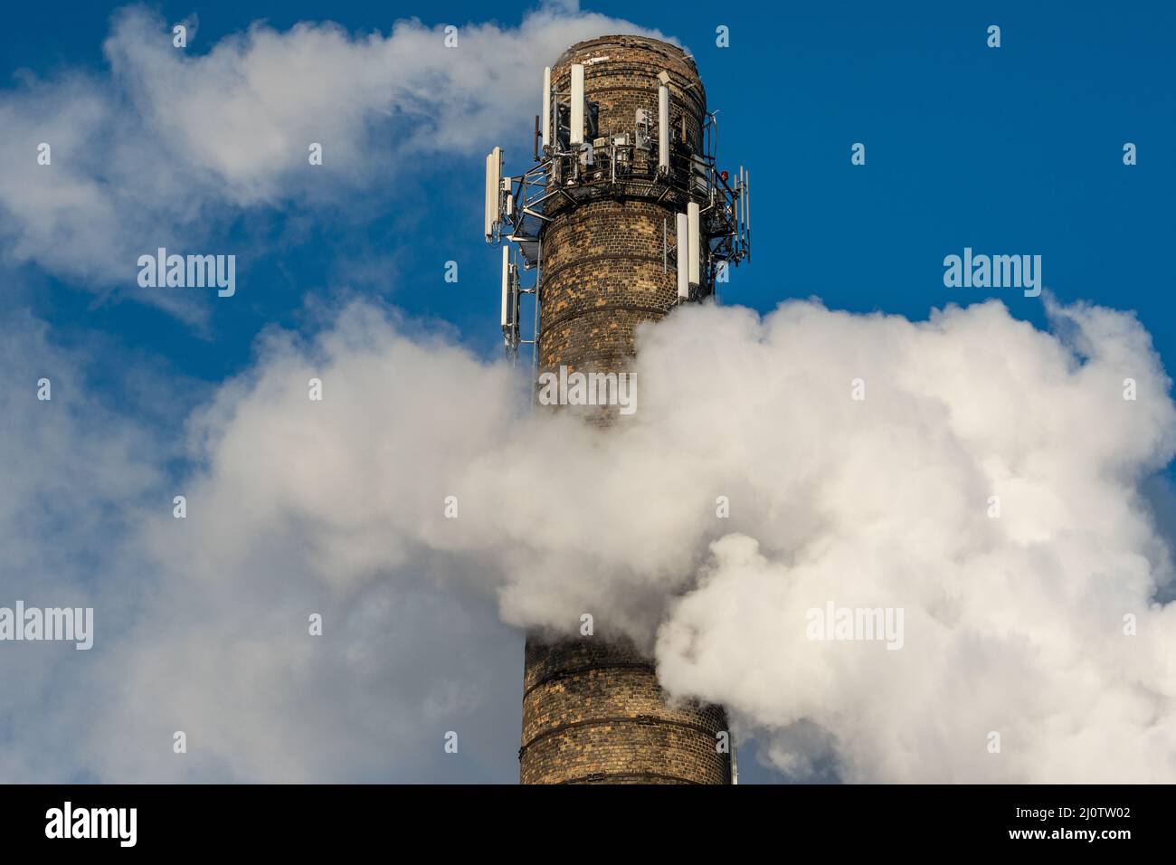 Industrial pipes produces gas into the atmosphere Stock Photo - Alamy