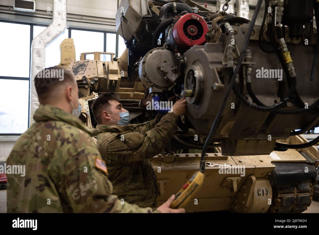 Staff Sgt. Brian Brewer looks on as Sgt. Brian Davis of Charlie Company ...